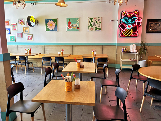 Clean, contemporary dining room with thoughtful touches&mdash;notice that neon lucky cat watching over diners like a delicious guardian angel.