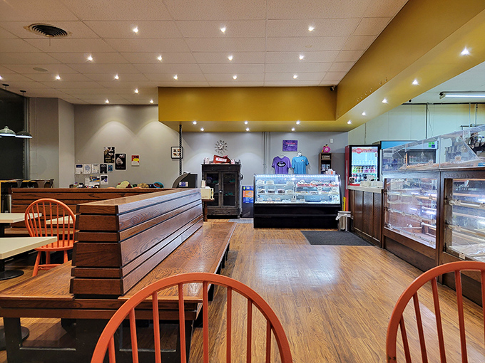 Bright yellow accents and multiple display cases signal serious dedication to the craft of baking done right.