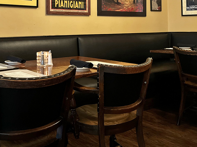Classic Italian restaurant ambiance with leather booths and warm lighting &ndash; where memories are made between bites of pasta.