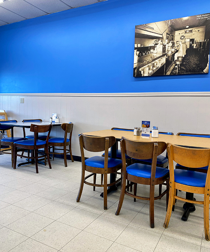 Historic photos adorn blue walls, telling stories of Tulsa's past while diners create new memories at these well-worn wooden tables.