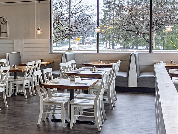Winter light streams through large windows, turning an ordinary breakfast into a snow-globe moment of dining perfection.