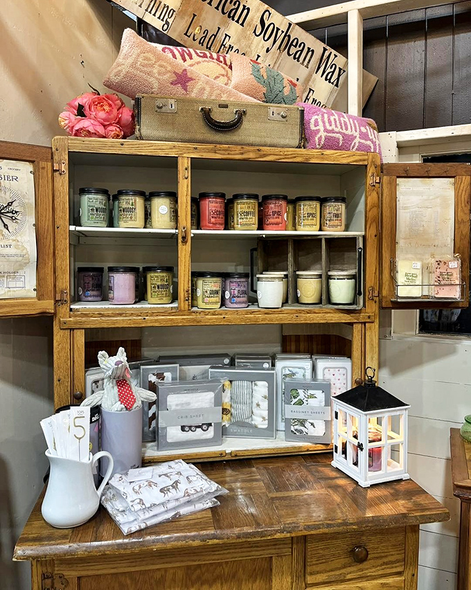 Mason jars filled with colorful candles sit atop rustic wood, proving that yesterday's storage solutions make today's perfect atmospheric lighting.