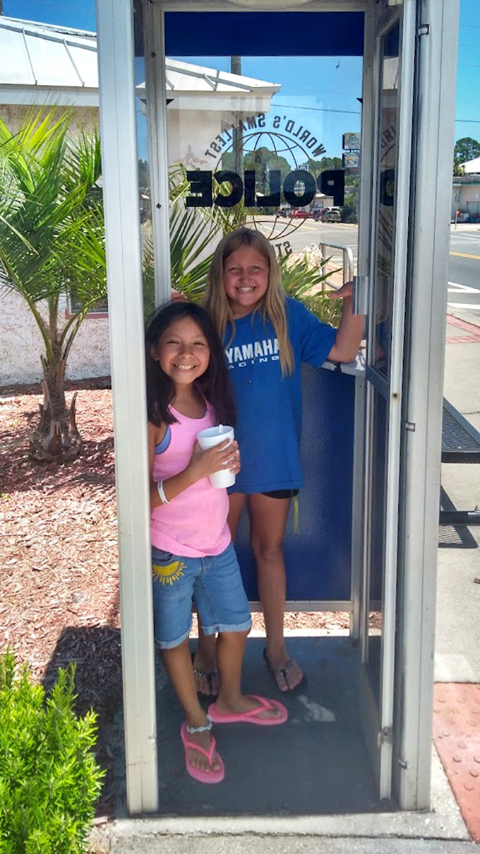 "But Mom, I think we could fit one more!" Young visitors discover the booth makes for a cozy, if somewhat cramped, vacation memory.