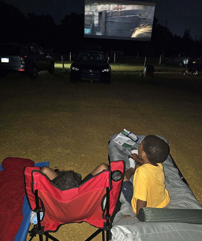 The true magic of drive-ins: kids can watch in pajamas, sprawled out in comfort. No shushing required when you're in your own space.