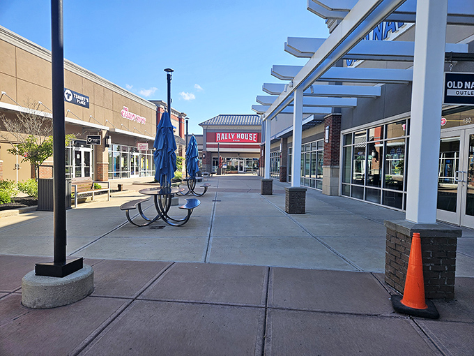 Wide, welcoming walkways guide shoppers between storefronts. Rally House stands in the distance, a beacon for Ohio sports fans seeking team gear.