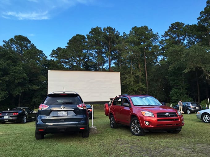 Cars line up with military precision, each claiming the perfect viewing spot. The art of drive-in parking is serious business.