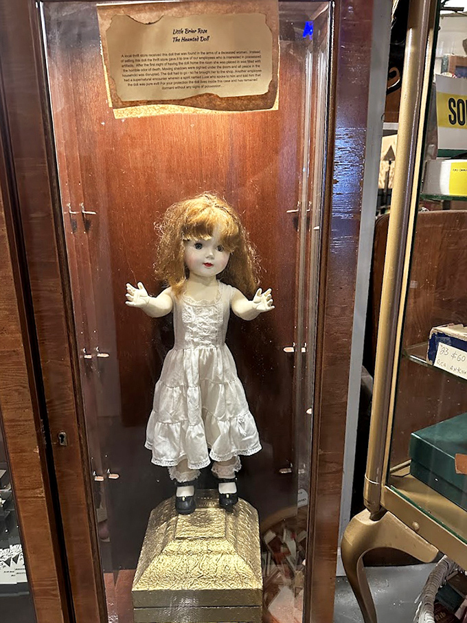 The haunting "Haunted Doll" display proves that some antiques come with stories that might keep you up at night.