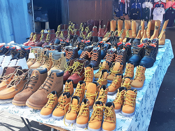 Boot boulevard! These sturdy soldiers line up with military precision, ready to march into someone's wardrobe and onto new adventures.