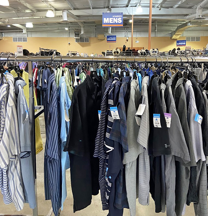 The men's section—where Hawaiian shirts and business casual peacefully coexist, waiting for their next adventure.