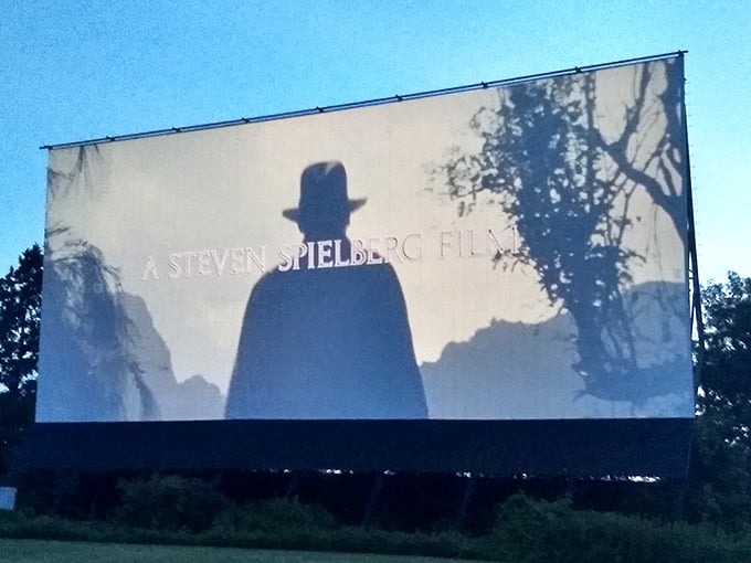 A Spielberg silhouette commands the massive screen, reminding us why we fell in love with movies in the first place.