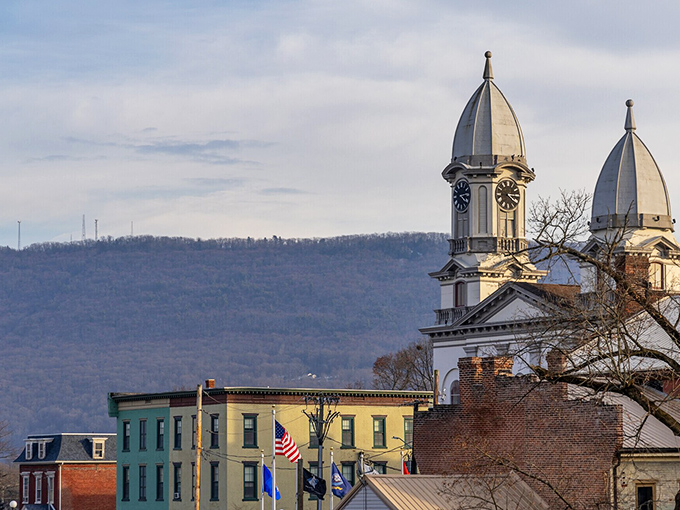 Church spires rise above colorful historic buildings, creating a skyline that reminds you some of life's most beautiful views don't require premium cable packages.