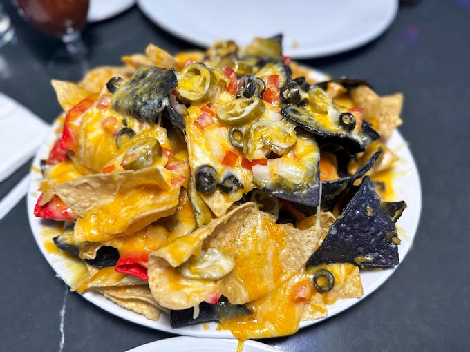 Nachos that require a topographical map to navigate &ndash; layers of cheese, jalape&ntilde;os, and olives creating a mountain range of Tex-Mex magnificence.