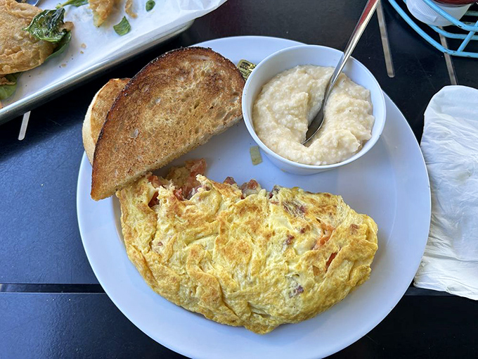 This omelet doesn't just sit on the plate&mdash;it lounges luxuriously, stuffed with fillings and paired with toast that's achieved that perfect golden-brown status.