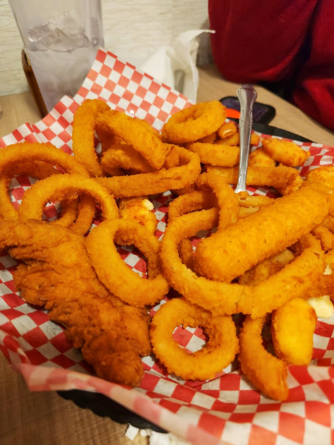 Onion rings served in that classic red checkered paper&mdash;the universal signal that something deliciously unpretentious is about to happen.