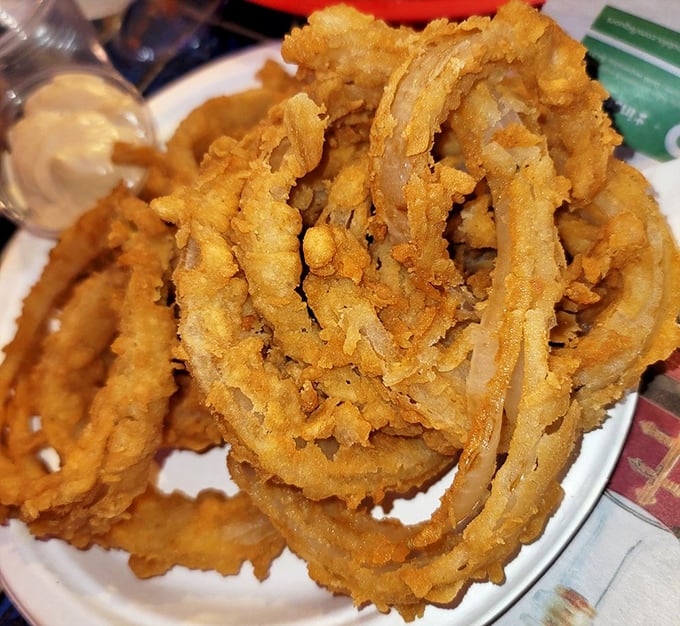 Onion rings that redefine the category&mdash;hand-cut, hand-battered jumbo beauties with a crunch you can hear across the restaurant.