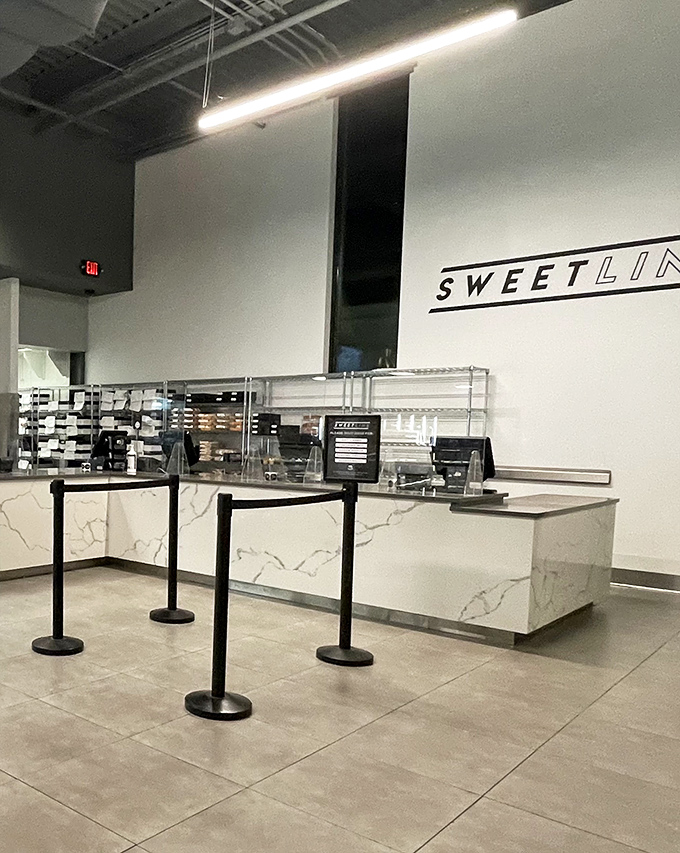 The "SWEETLINE" counter stands ready for action, a modern command center where pastry dreams become take-home realities.