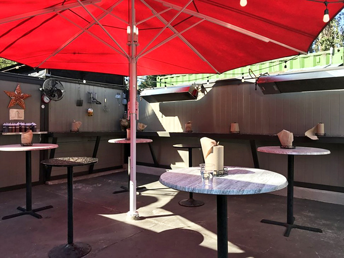 The outdoor dining area&mdash;where strangers become friends united by the universal language of "mmm" and "have you tried the brisket yet?"