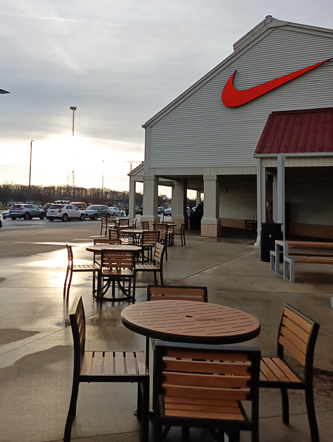 Even the outdoor seating area sports the iconic Nike swoosh. These tables have witnessed countless "should I go back for it?" debates.