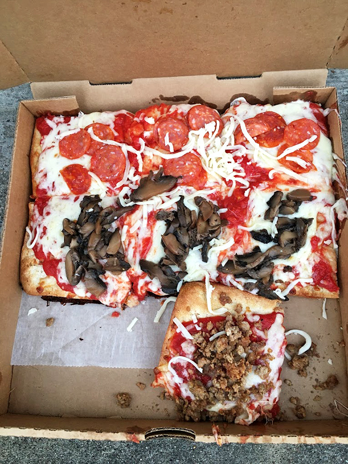 The holy trinity of pizza toppings&mdash;pepperoni, mushrooms, and sausage&mdash;living harmoniously on one magnificent slice. Pizza diplomacy at its finest.