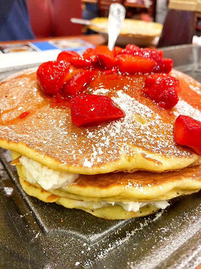 Pancakes that don't just sit on the plate&mdash;they float above it, impossibly fluffy and crowned with fresh strawberries.