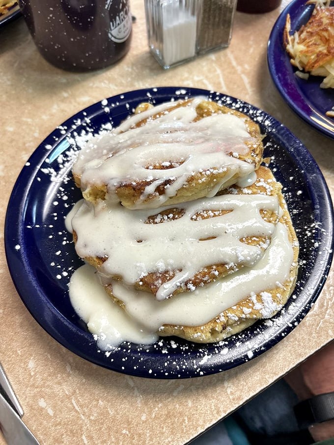 Golden pancakes drizzled with icing that melts into every nook and cranny &ndash; breakfast's answer to dessert, and nobody's complaining.