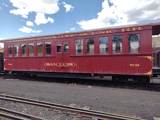 The "San Luis" passenger car's rich burgundy exterior promises a journey where the seating is vintage but the memories are brand new. 
