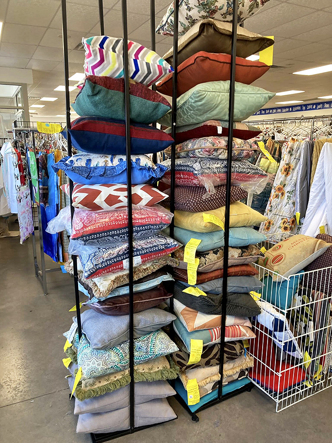 Pillow paradise! This towering stack of cushions offers instant home makeovers for the price of a fancy coffee.