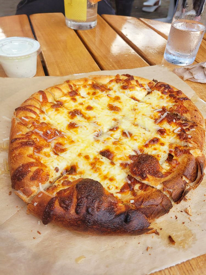 Pizza perfection in Traverse City&mdash;a golden-brown crust with cheese that stretches for days, making a compelling case for "just one more slice."