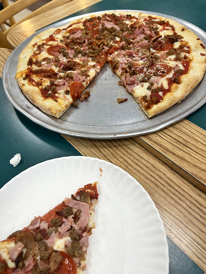 The meat lover's dream realized: a pizza that doesn't skimp on the good stuff. That perfect circle of ham, pepperoni, and sausage is practically a protein supplement.