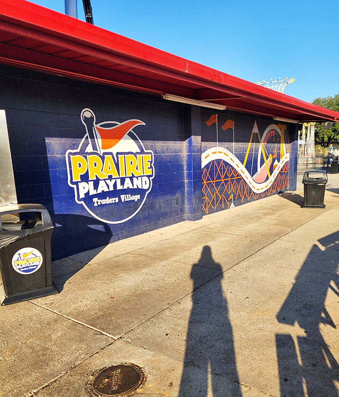 The Prairie Playland mural promises roller coaster thrills beyond the bargains, because shopping works up an appetite for adventure too.