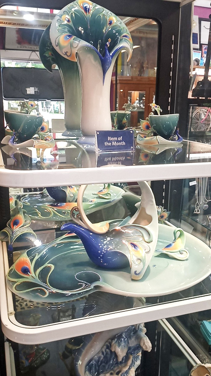 This peacock-inspired porcelain set, labeled "Item of the Month," combines elegance and whimsy in a way that would elevate any dinner party.