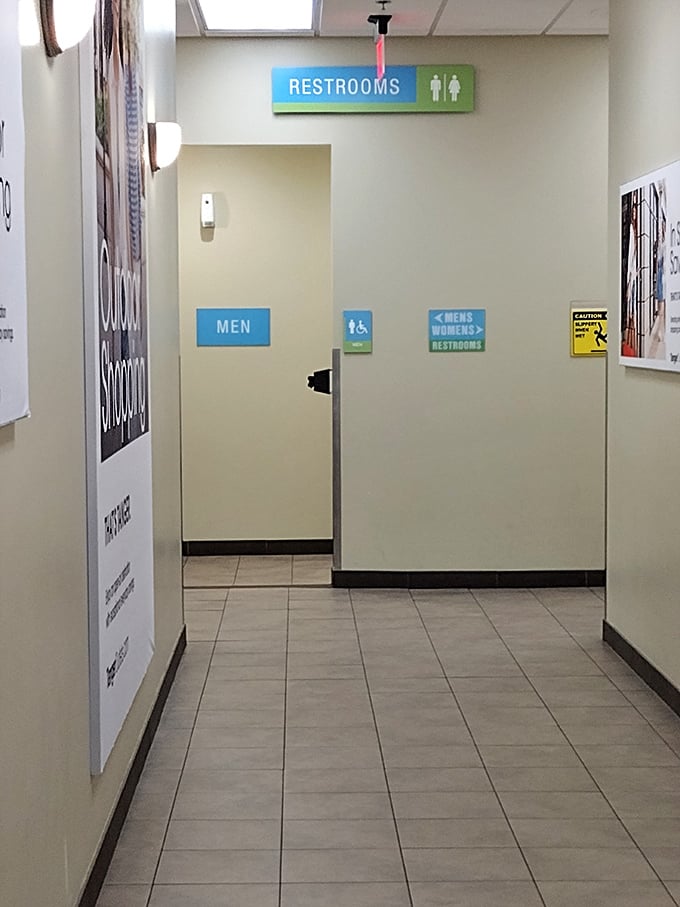 Even the restroom signage maintains the outlet's clean, organized aesthetic&mdash;because shopping marathons require proper pit stops.