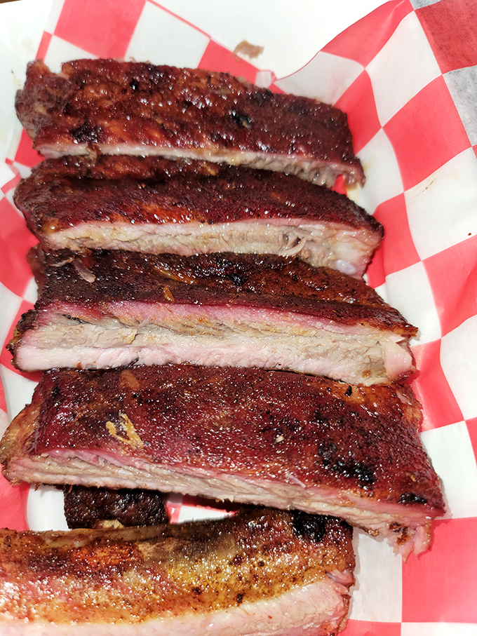 St. Louis ribs with that perfect pink smoke ring&mdash;the kind that make you temporarily forget table manners exist in polite society.