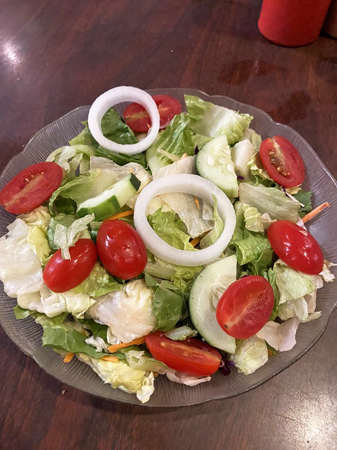 A simple house salad that proves even at a seafood joint, the kitchen respects the need for something green between bites of oceanic treasure.