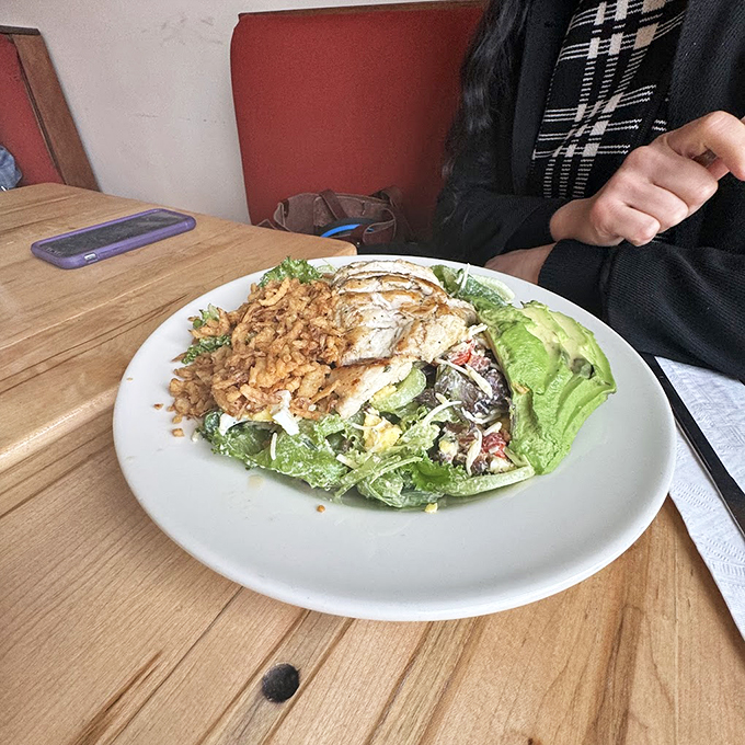 A salad that makes eating greens feel like cheating. Topped with protein and crunchy elements, it's the kind of healthy choice that doesn't feel like punishment.