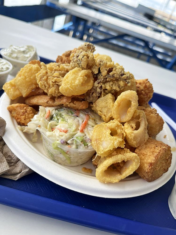 The seafood platter solves life's greatest dilemma: why choose one seafood treasure when you can have them all in golden-fried perfection?