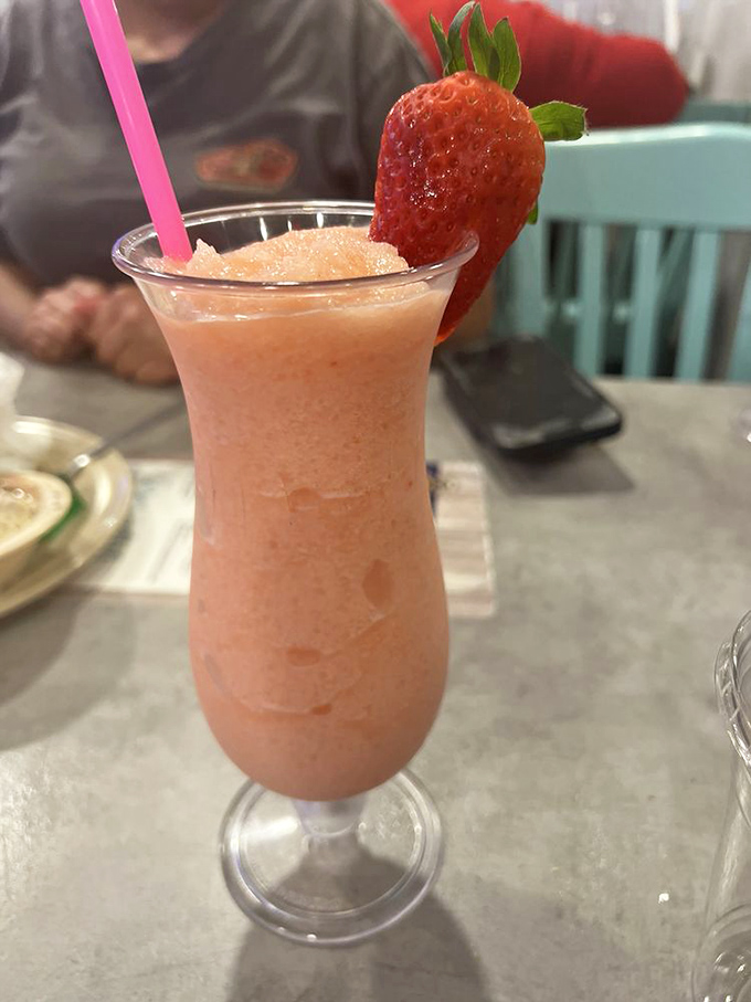 A strawberry smoothie that looks like summer in a glass. The perfect refreshing counterpoint to a parade of savory seafood delights.