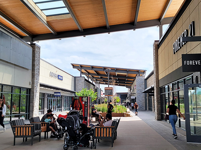 The outdoor walkways invite leisurely browsing between stores, where shopping bags multiply like rabbits and smiles come standard.