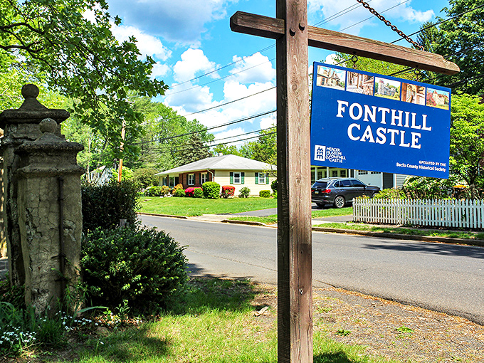 The humble blue sign belies the wonderland that awaits – like finding Narnia behind a suburban white picket fence.