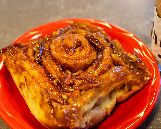 Not just a sticky bun&mdash;a gravity-defying spiral of caramelized glory. The kind of pastry that makes you consider ordering a second before finishing the first.