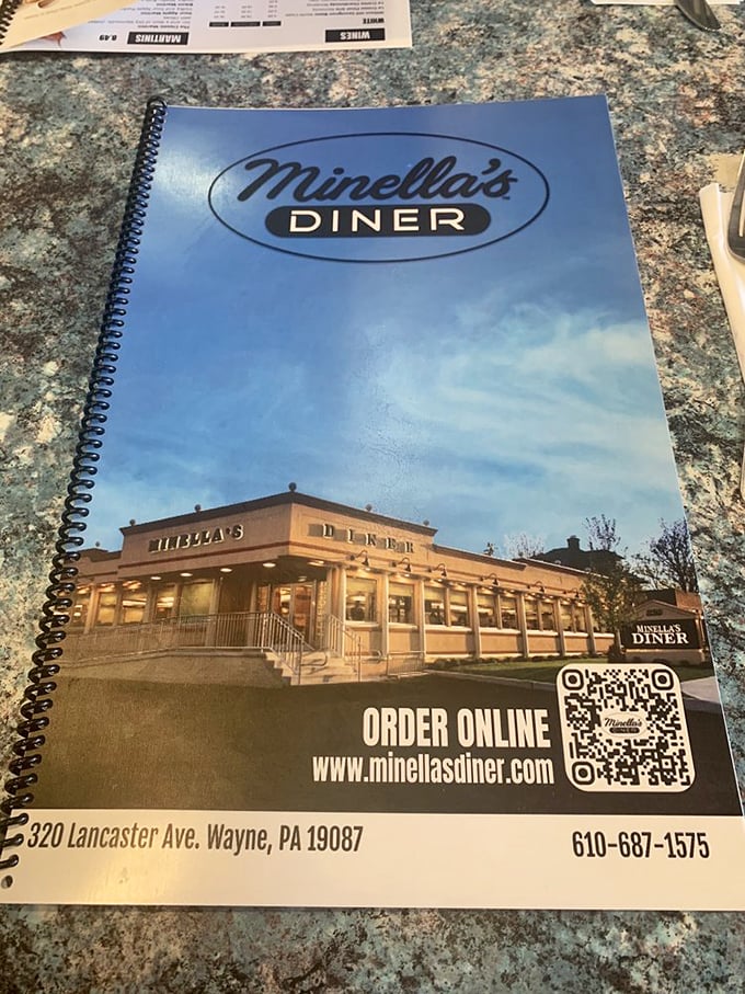 The diner's menu cover showcases both tradition and practicality &ndash; complete with the modern touch of a QR code for those who prefer digital browsing.