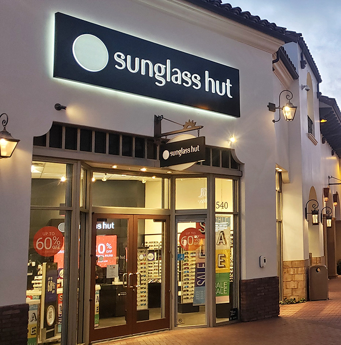 Sunglass Hut's 60% off signs create that special moment when "I shouldn't" transforms magically into "I deserve this."