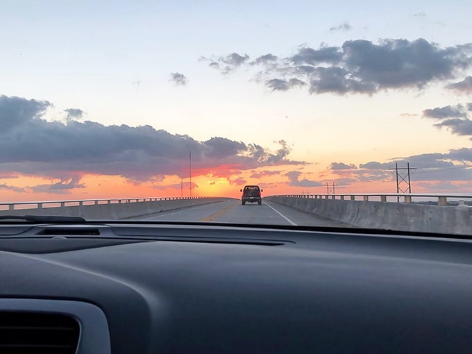 Chasing the sunset on the Overseas Highway. When the sky puts on a show like this, even the most jaded drivers pull over for a moment.