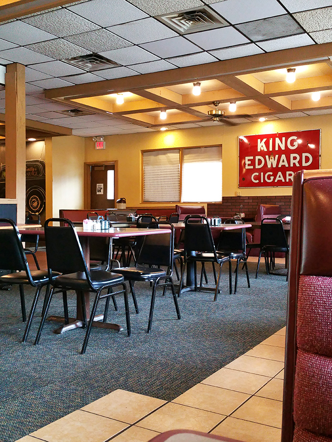Classic diner seating under warm coffered ceilings. That vintage King Edward Cigar sign has witnessed countless first dates and family celebrations.
