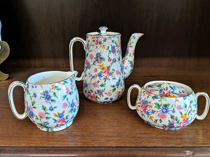 This vintage chintz tea set isn't just dishware; it's a portal to elegant afternoons that existed before Netflix marathons replaced social gatherings.