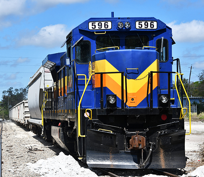 The locomotive's face seems to smile with anticipation, knowing it's about to deliver memories more lasting than any souvenir.
