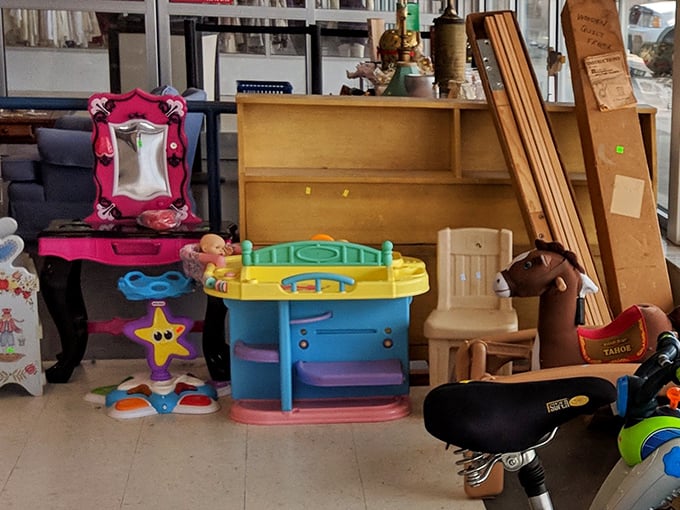 Childhood dreams line these shelves, from rocking horses to play kitchens, each toy whispering stories of past playtimes while awaiting new adventures.