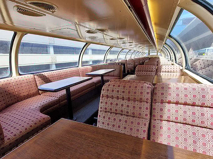 Mid-century modern meets railroad elegance in these observation cars, where geometric upholstery and panoramic windows create the perfect viewing lounge.