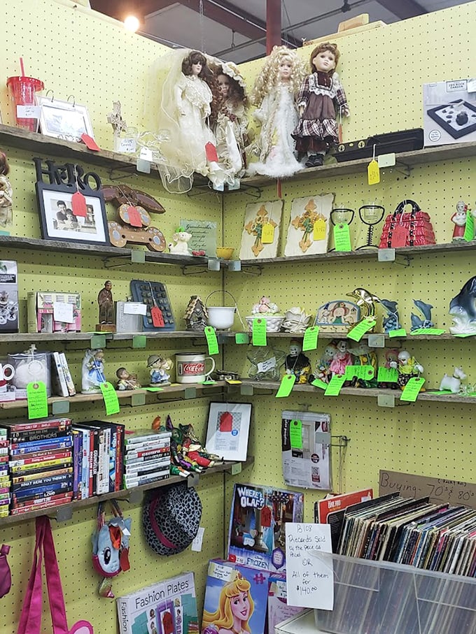 Pegboard paradise where collectibles create a visual buffet. The green price tags are your permission slips to take treasures home.