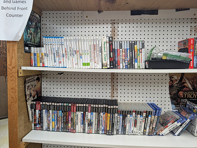 Video games from every era create a digital archaeology display that spans decades of entertainment evolution.